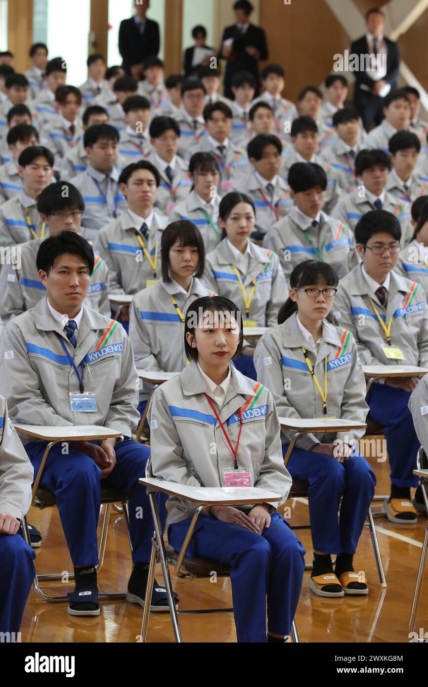 New employees of Kyudenko Co. attend an annual entrance ceremony in ...