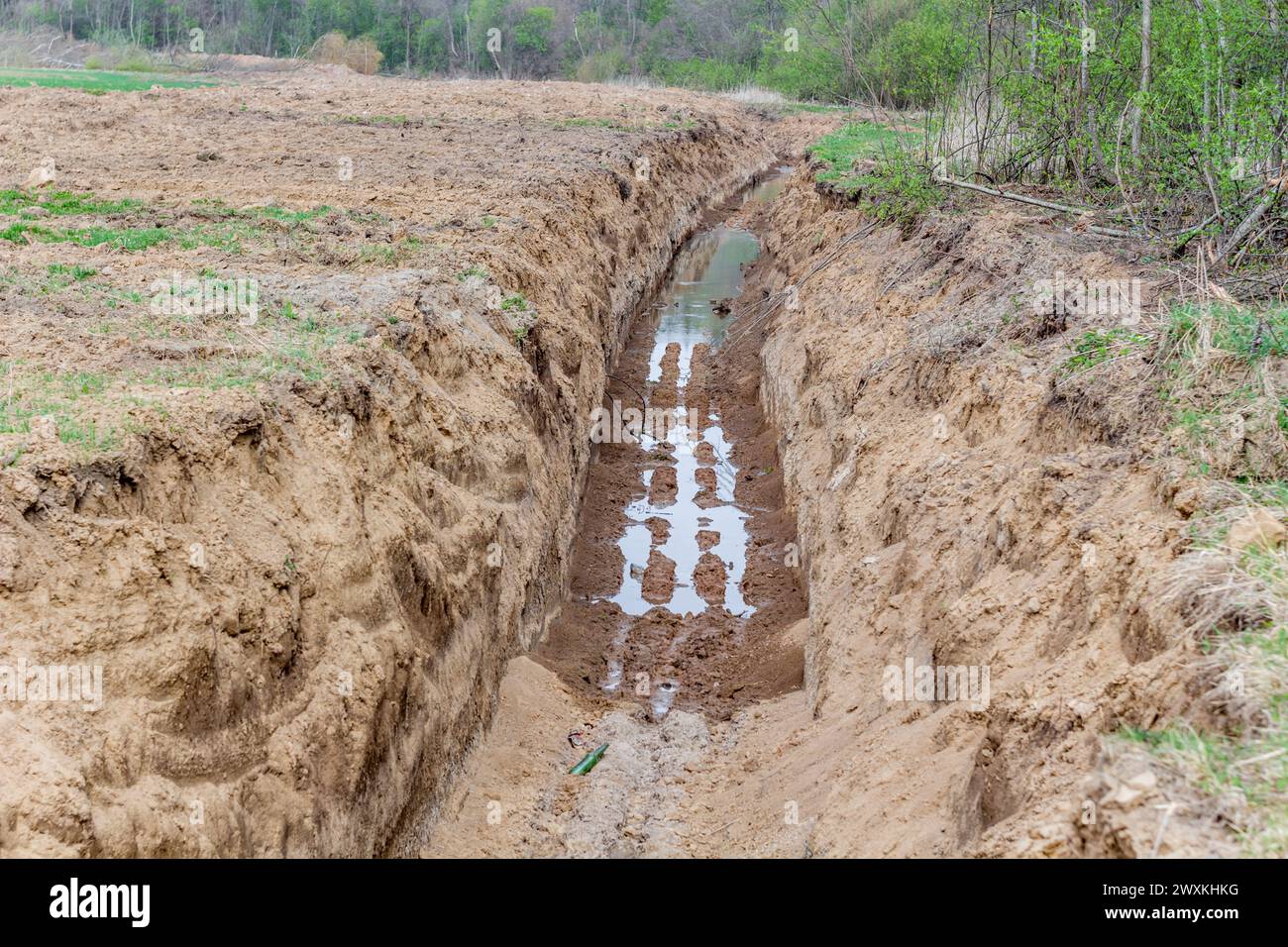Dug in the ground a big trench Stock Photo - Alamy