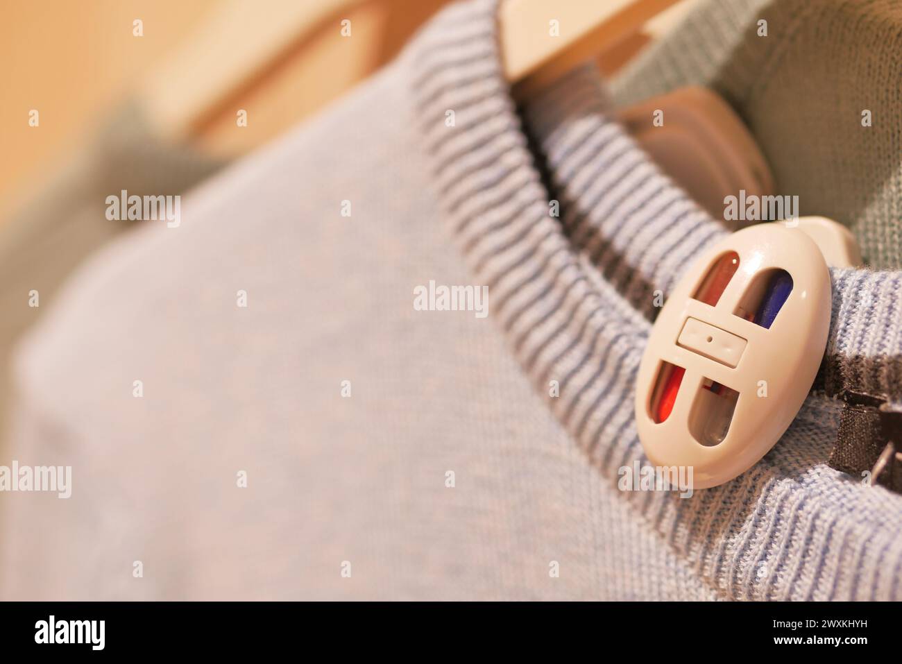 Clothing security tag on a shirt Stock Photo - Alamy