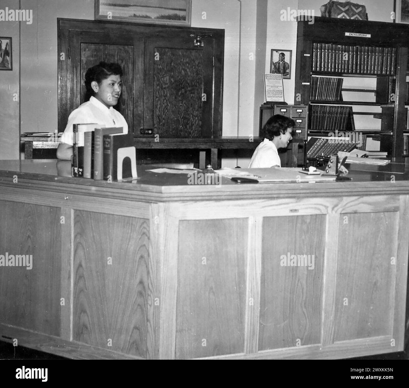 Two students working in the library of an Indian school in South Dakota ...