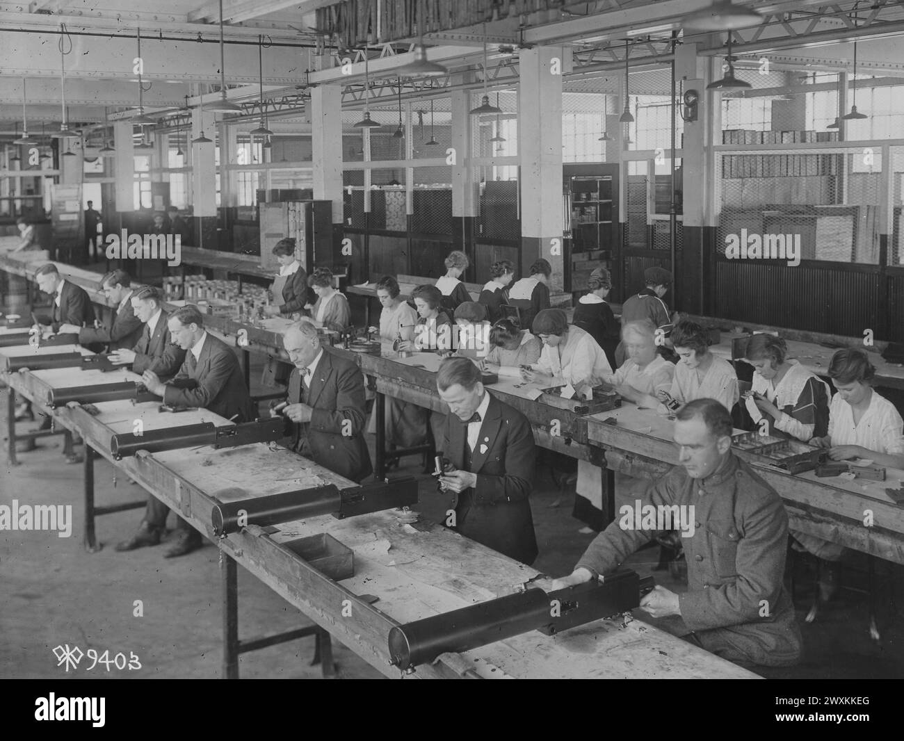 U.S. inspectors take apart Browning heavy machine guns and interchange ...