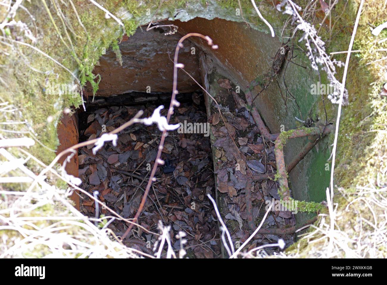 Unclosed old sewer hatch, sinking into the ground Stock Photo - Alamy