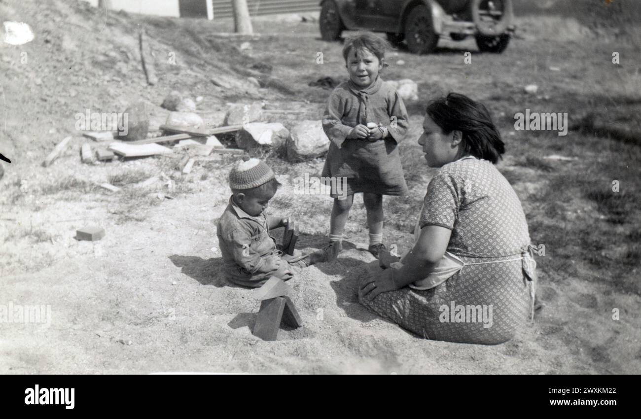 Woman and Two Children Playing in Sand Pit at the Sisseton-Wahpeton ...