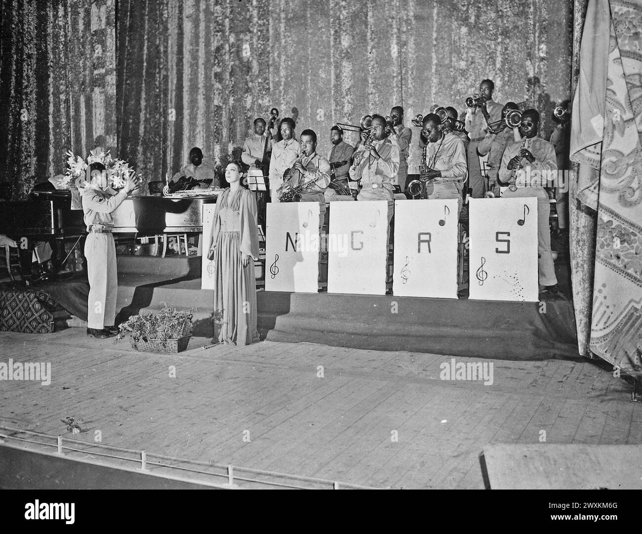 Miss Josephine Baker, popular stage performer, sings the National ...