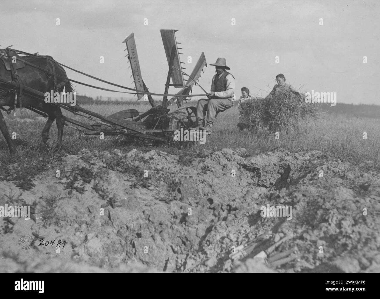 Farmer reaping wheat Black and White Stock Photos & Images - Alamy