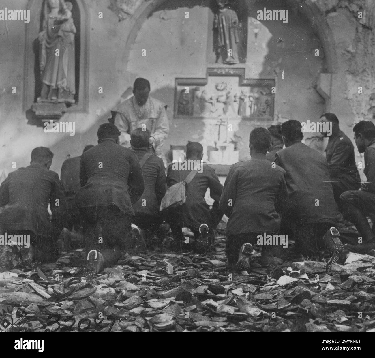 An army chaplian conducts a worship service and serves holy communion ...