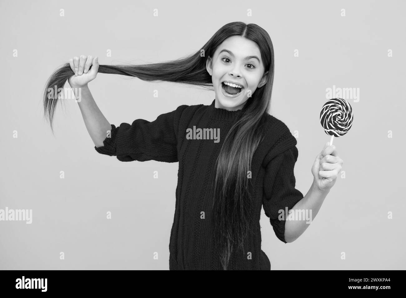 Excited face. Teenage girl with lollipop, child eating sugar lollipops ...