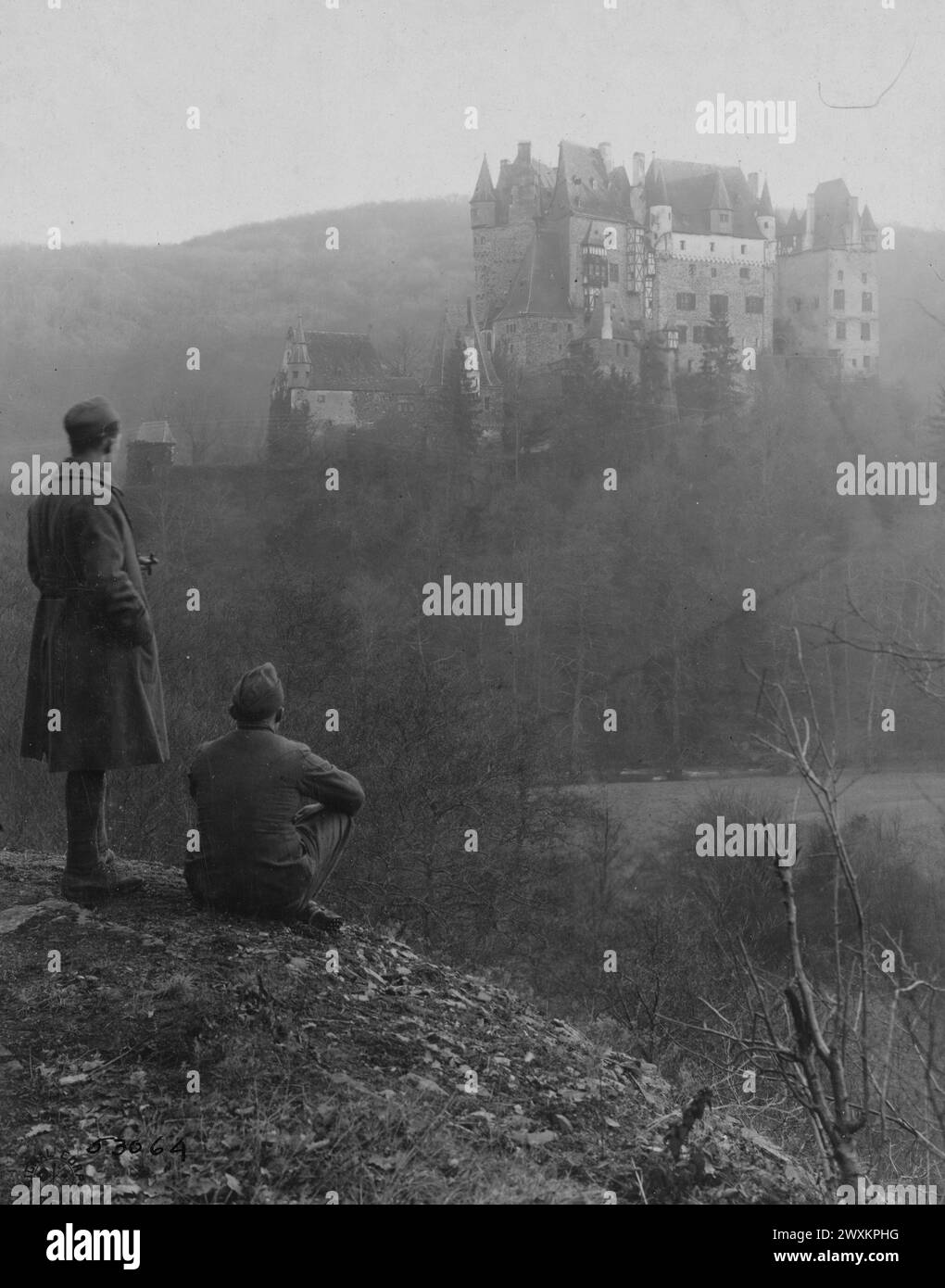 Soldiers with a view of Burg Elltz, the old castle near Moselkern ...