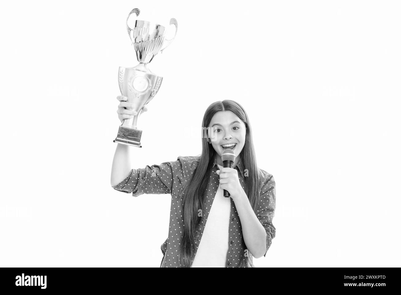 Teenage girl with win cup microphone speech. Teen holding a trophy. Kid ...