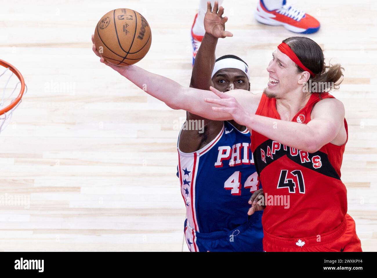 Toronto, Canada. 31st Mar, 2024. Kelly Olynyk (R) of Toronto Raptors ...