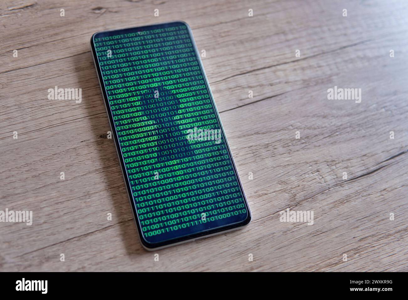 Smartphone with glowing binary code and keyhole on the screen. Copy ... Smartphone with glowing binary code and keyhole on the screen. Copy ...