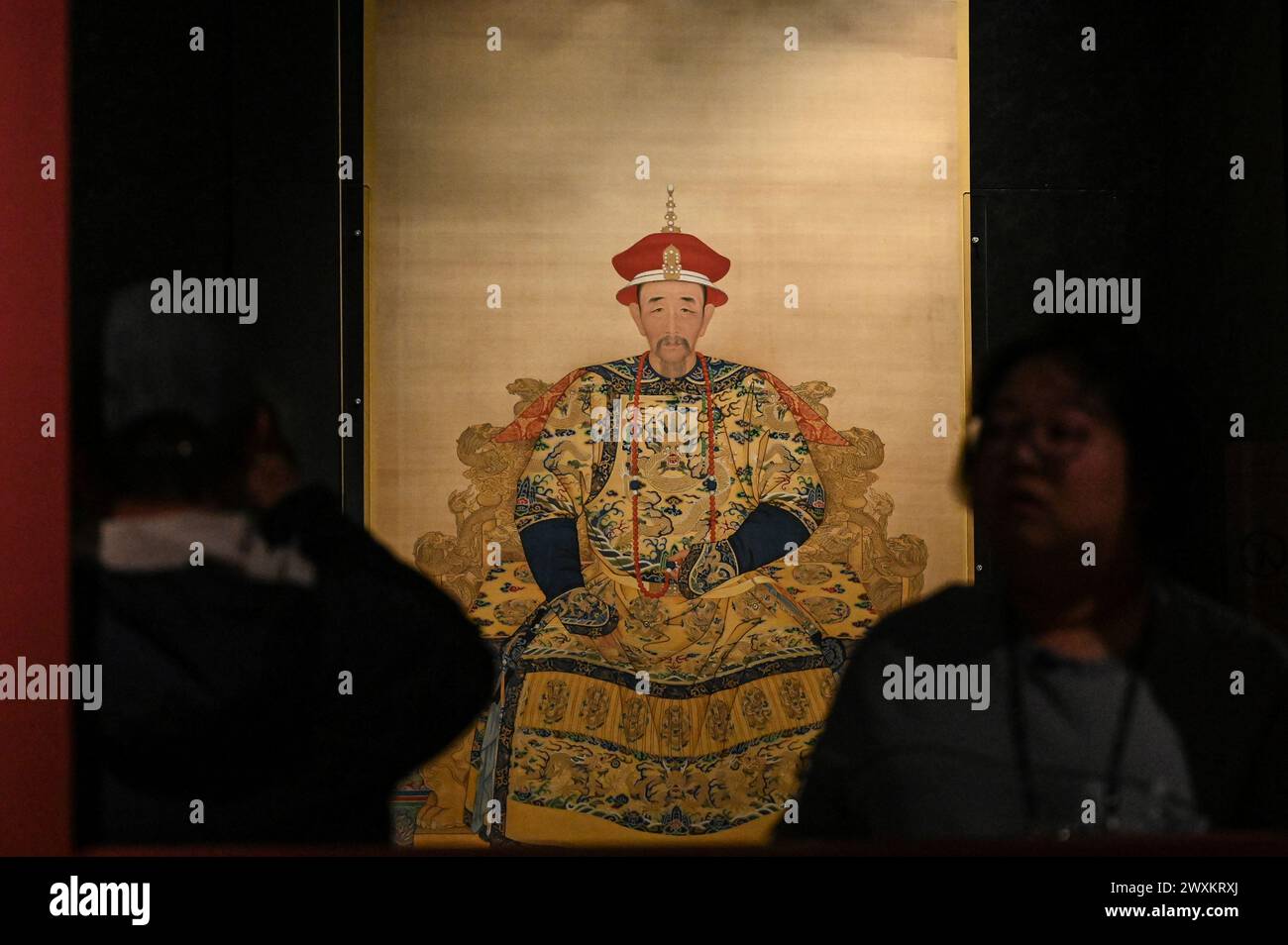 A replica of Kangxi emperor in court robe is seen during a media ...