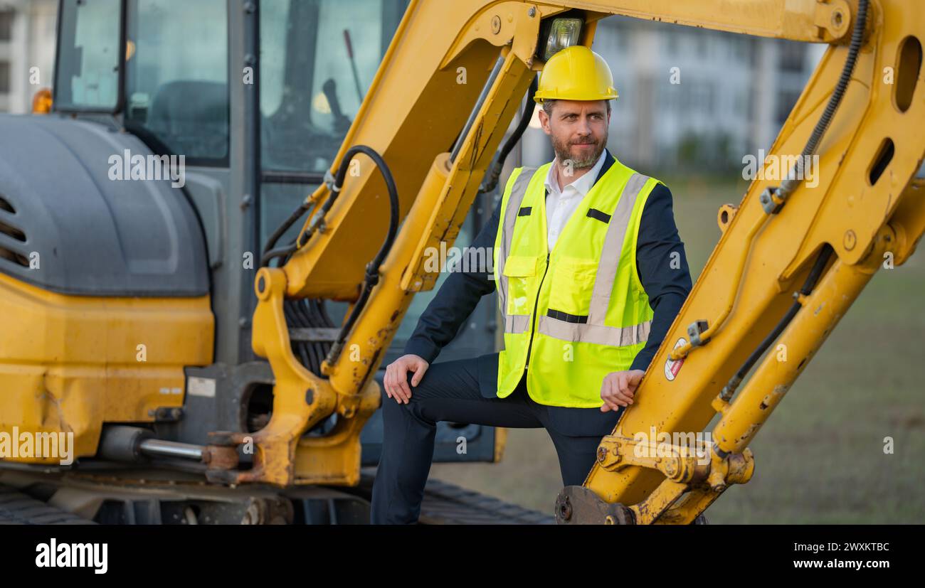 Civil engineer worker at a construction site. Engineer man in front of ...