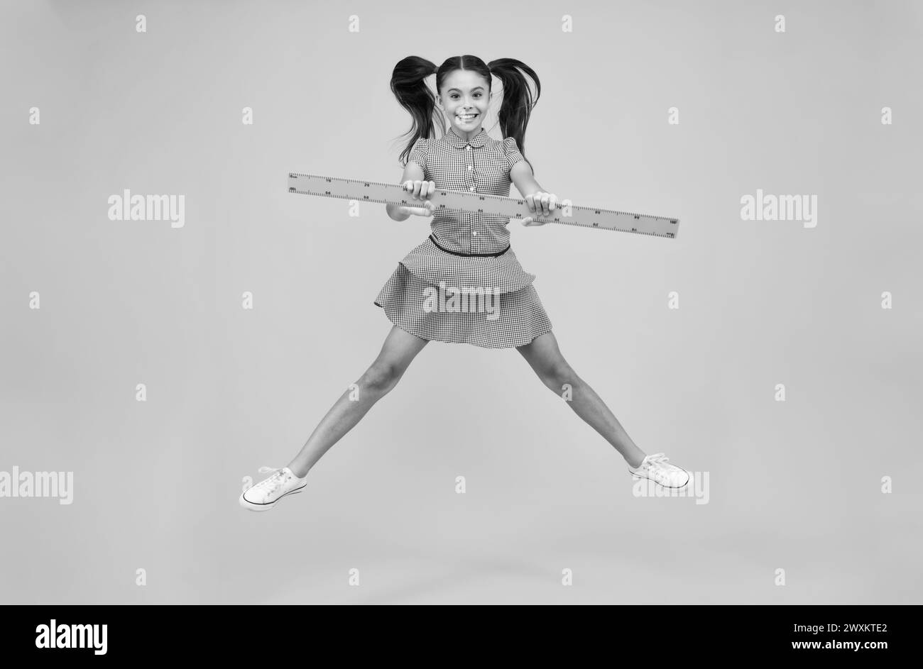 Teenager school girl study math or geometry lesson, measure the size ...