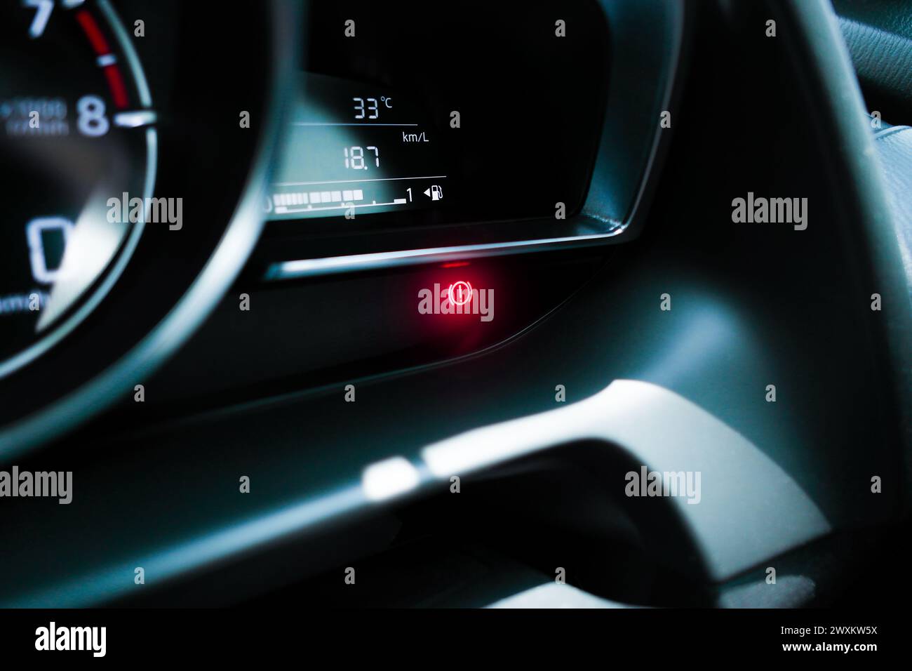 Brake warning light illuminated on instrument panel in a car ...