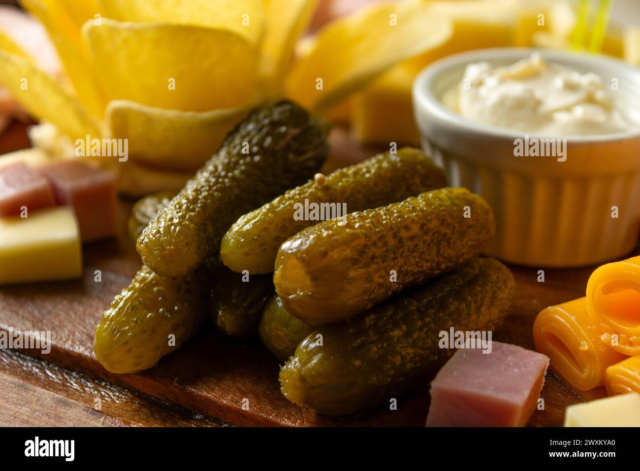 The Assorted pickles, cheese, and crackers on display Stock Photo - Alamy