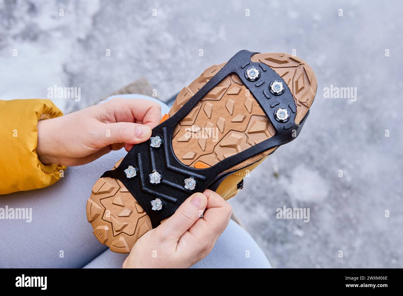 Rubber pads, anti-icing spikes for boots, are worn on trekking winter ...
