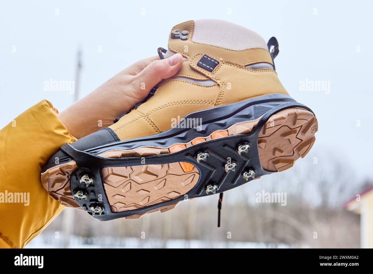 Ice grips for walking on icy or slippery surfaces, traction tread outsole and cleats ...