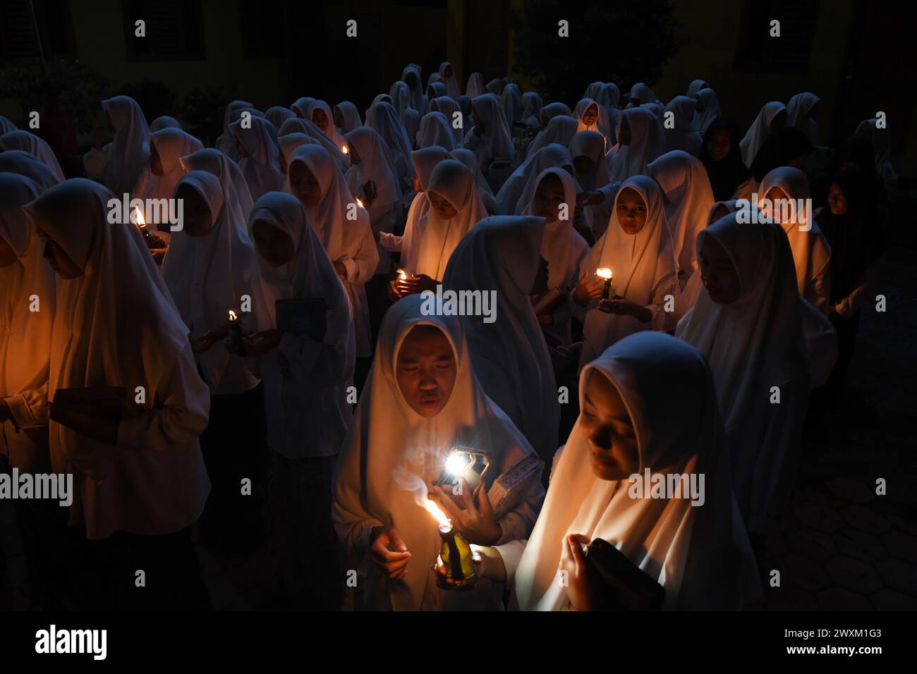March 31, 2024, Boyolali, Central Java, Indonesia: Students pray and ...