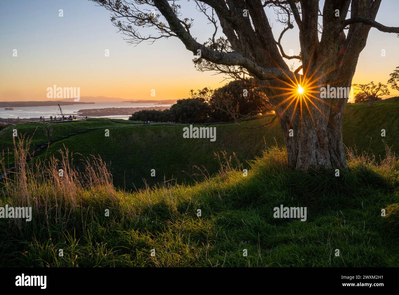 Sunrise over Mt Eden summit with volcanic crater in the foreground. Sun ...