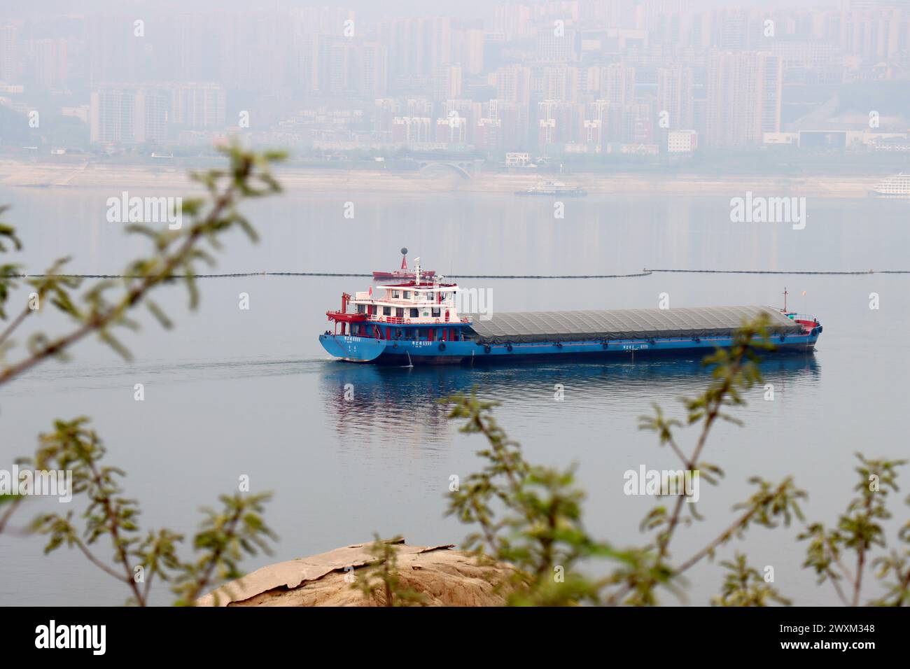 YICHANG, CHINA - APRIL 1, 2024 - Cargo ships sailing in the waters of ...