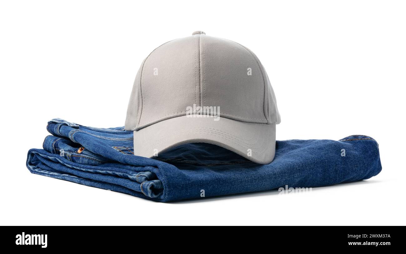 Grey Baseball Cap Placed on Folded Blue Jeans Against White Background ...