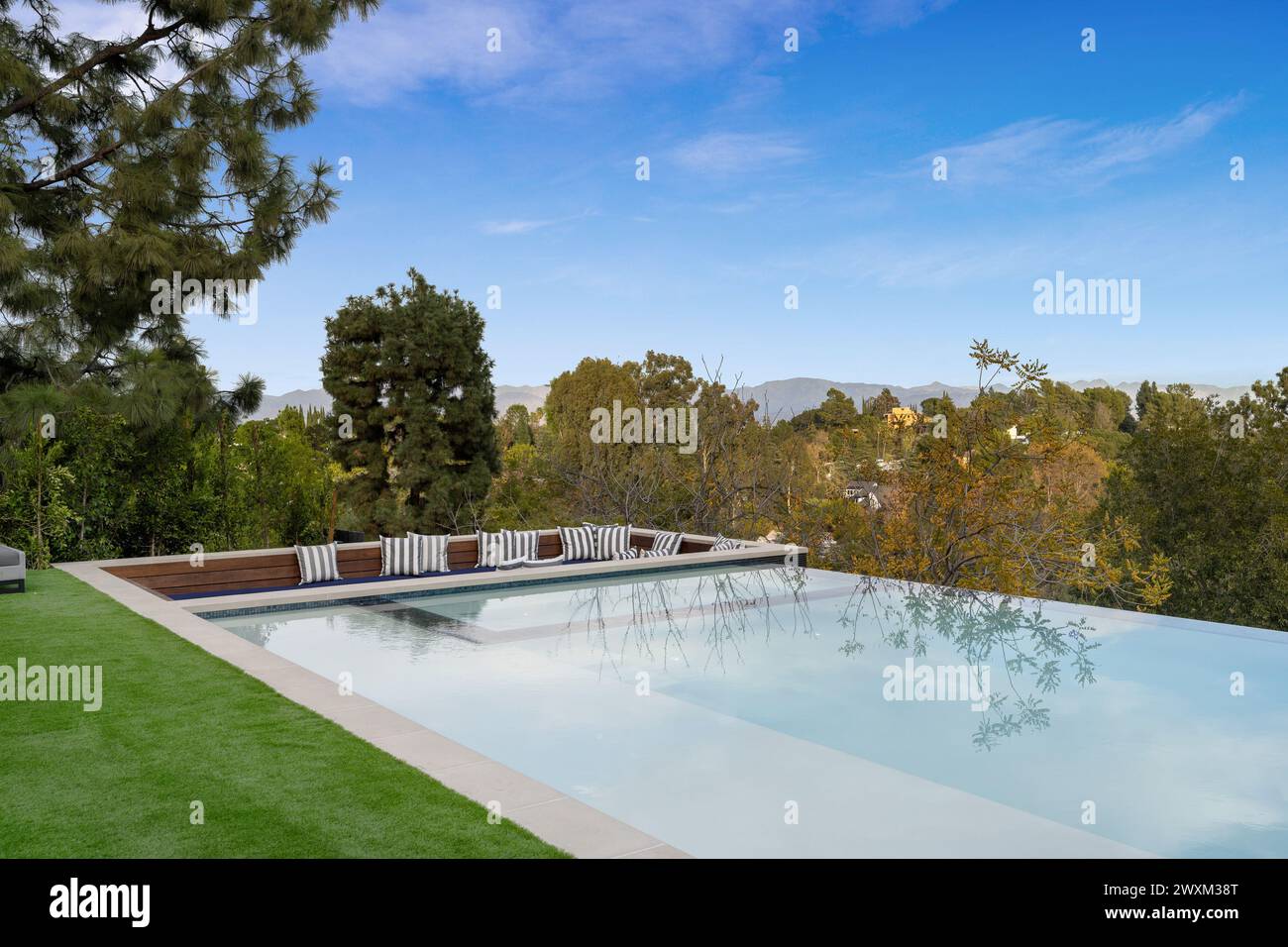 A spacious rectangular pool in a residential backyard Stock Photo - Alamy