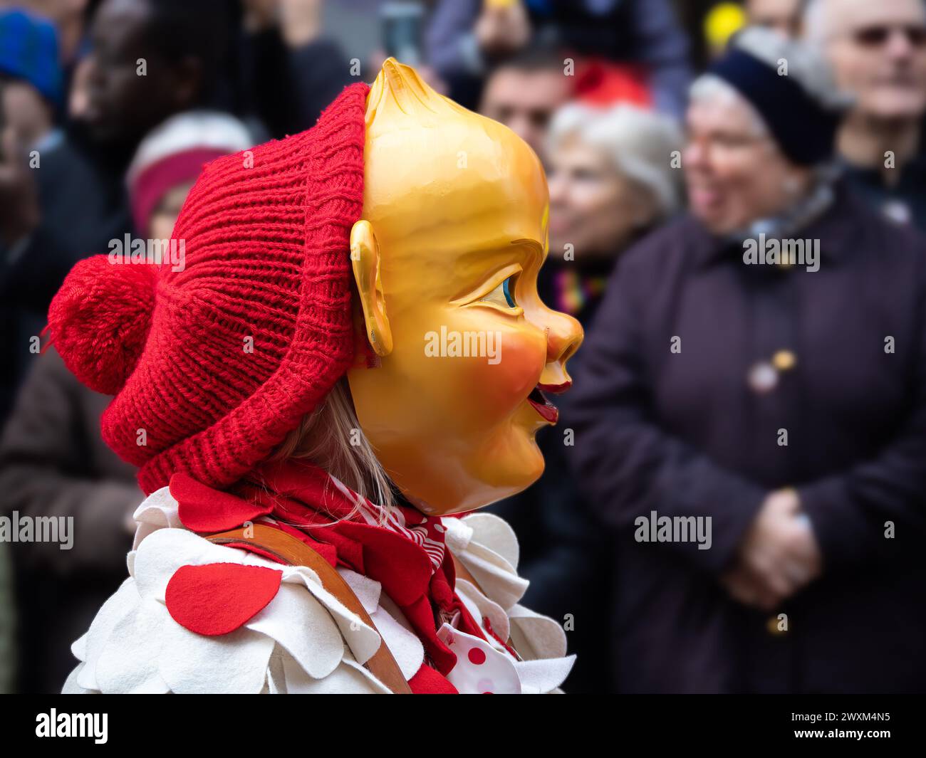 Masquerade. Beautiful mask in a carnival parade with blurred people in ...