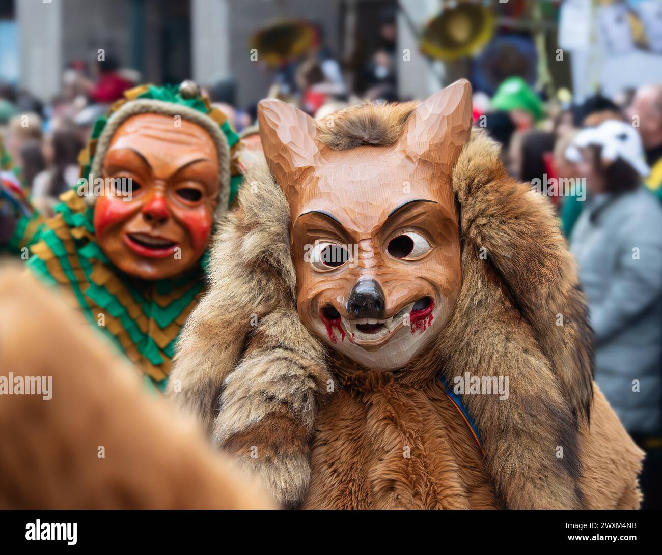 Masquerade. Beautiful masks in a carnival parade with blurred people in ...