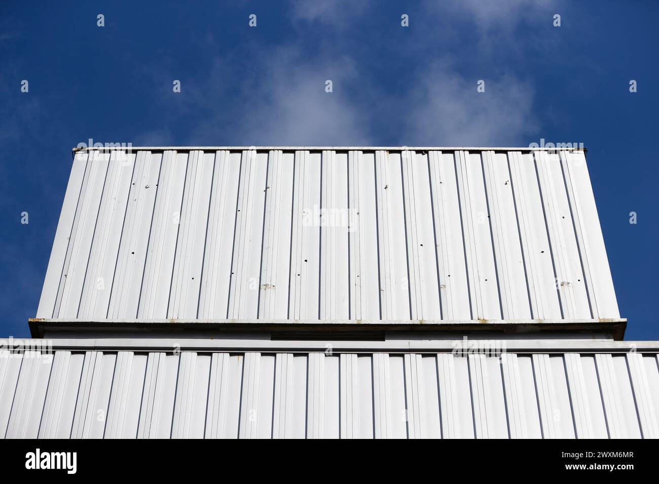 Aluminium cladding low angle view with blue sky and light clouds in ...