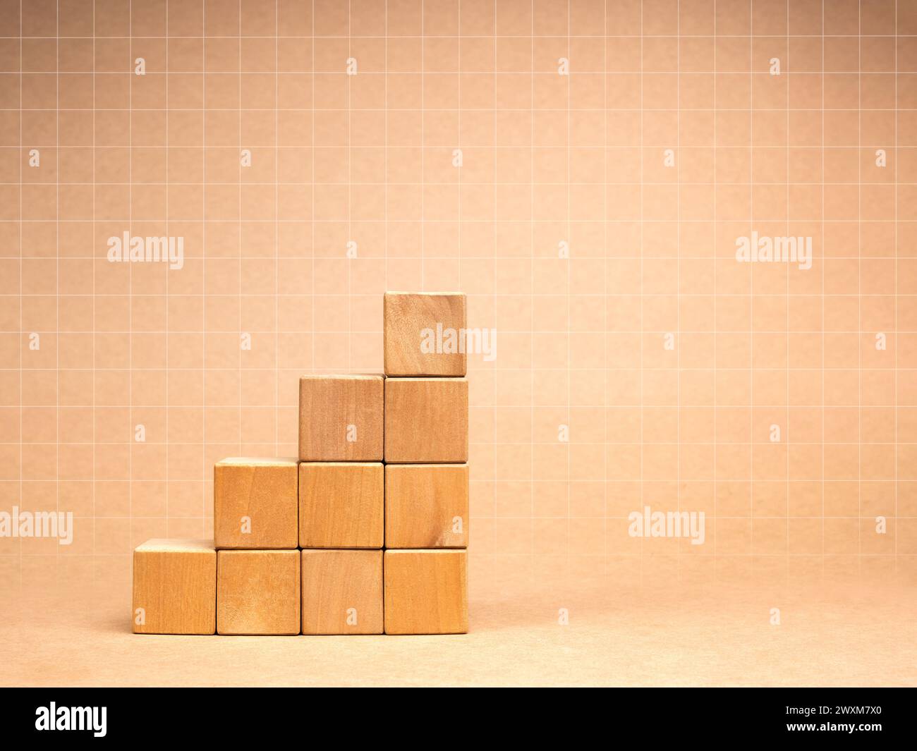 Blank wooden cube blocks bar graph chart steps on grid pattern and ...