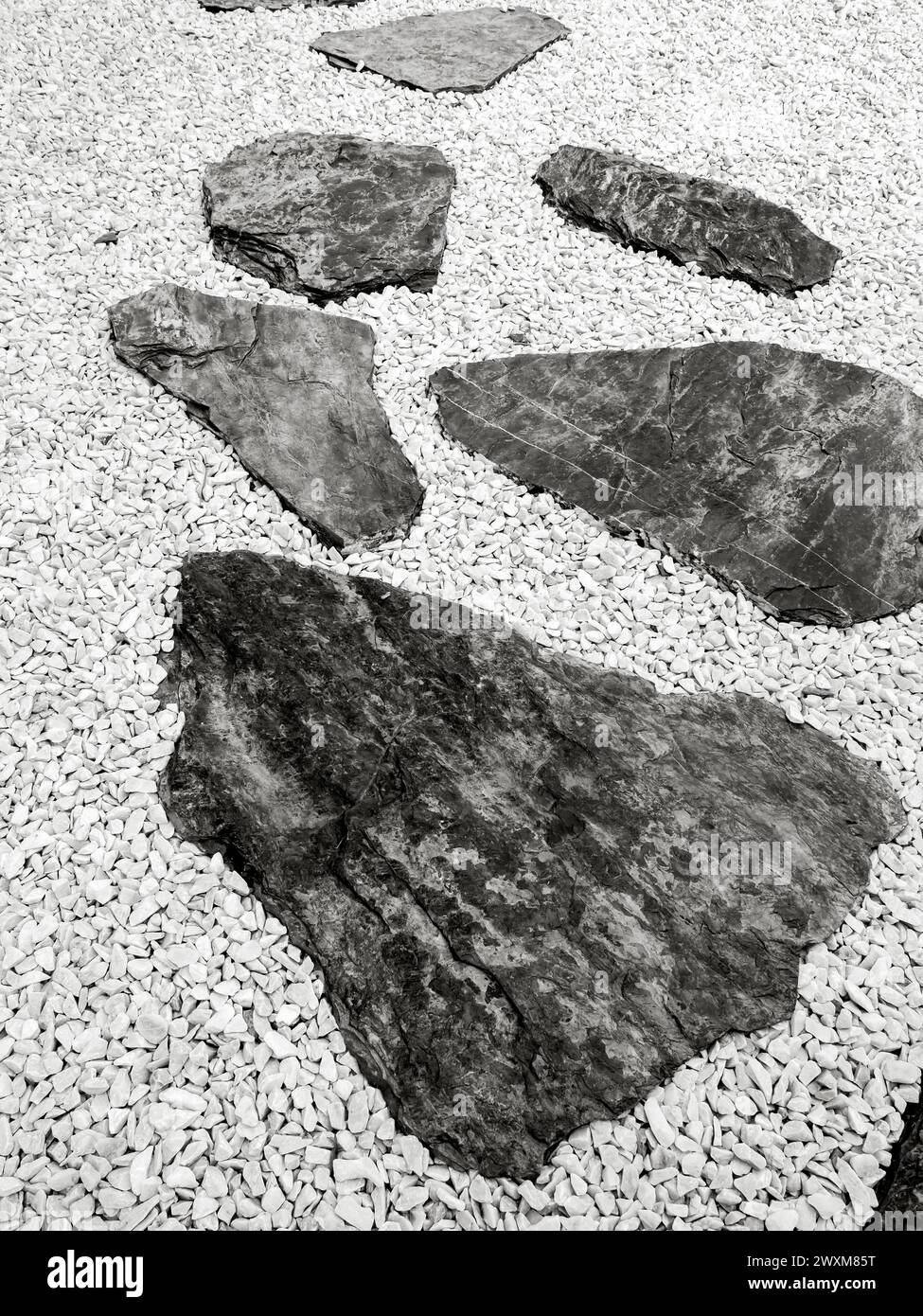 Black granite slabs cut into free-form shapes were laid out to decorate ...