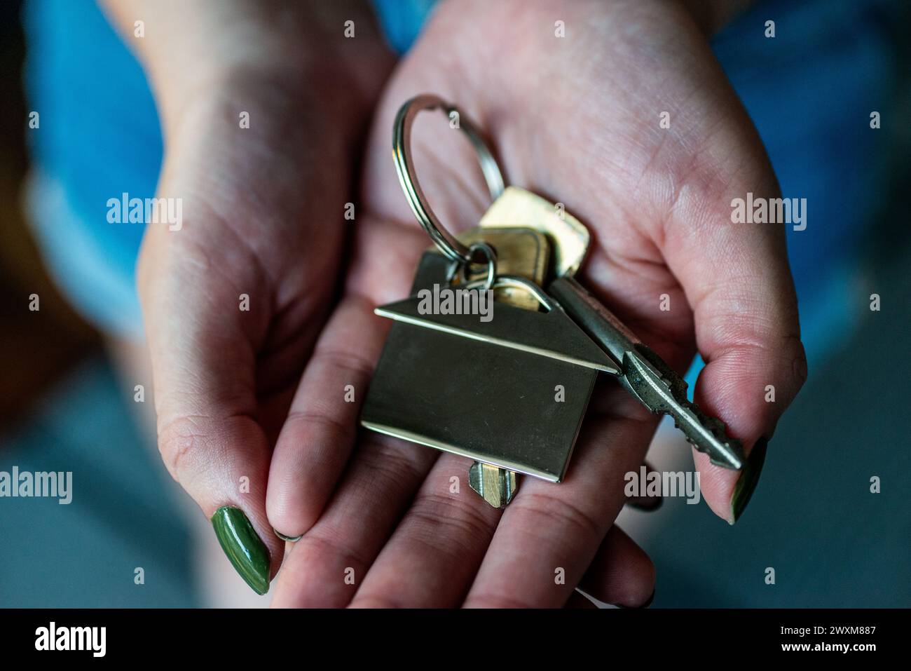 A close-up shot of hands holding keys Stock Photo - Alamy
