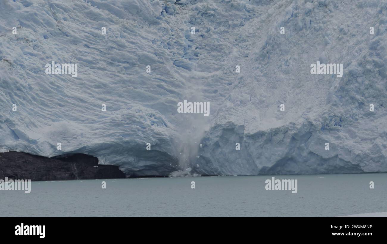 Glacial Calving Event Capturing Ice Falling into Ocean Stock Photo - Alamy