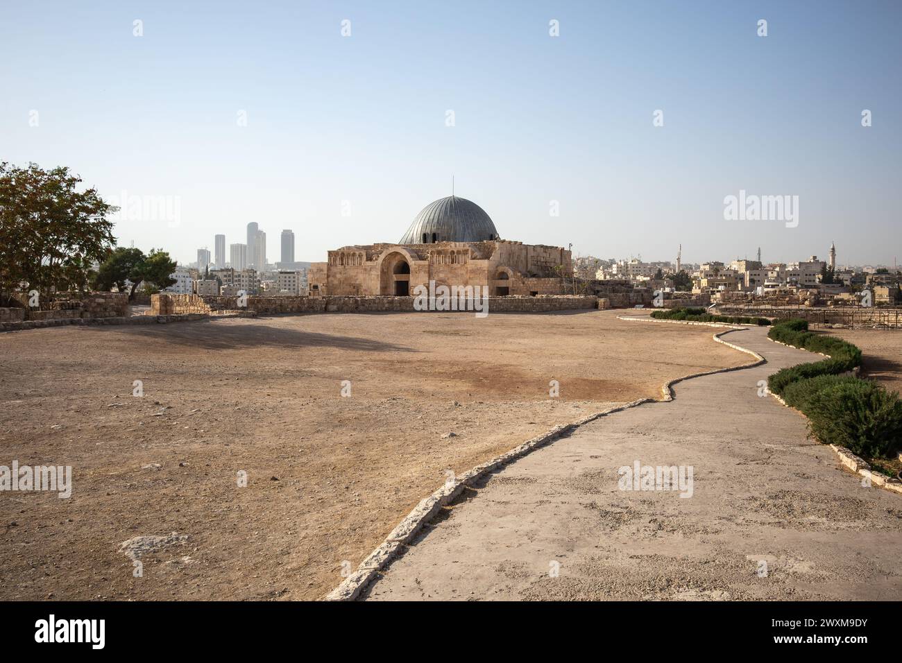 Path leading to Umayyad Palace with Modern Architectural Buildings in ...