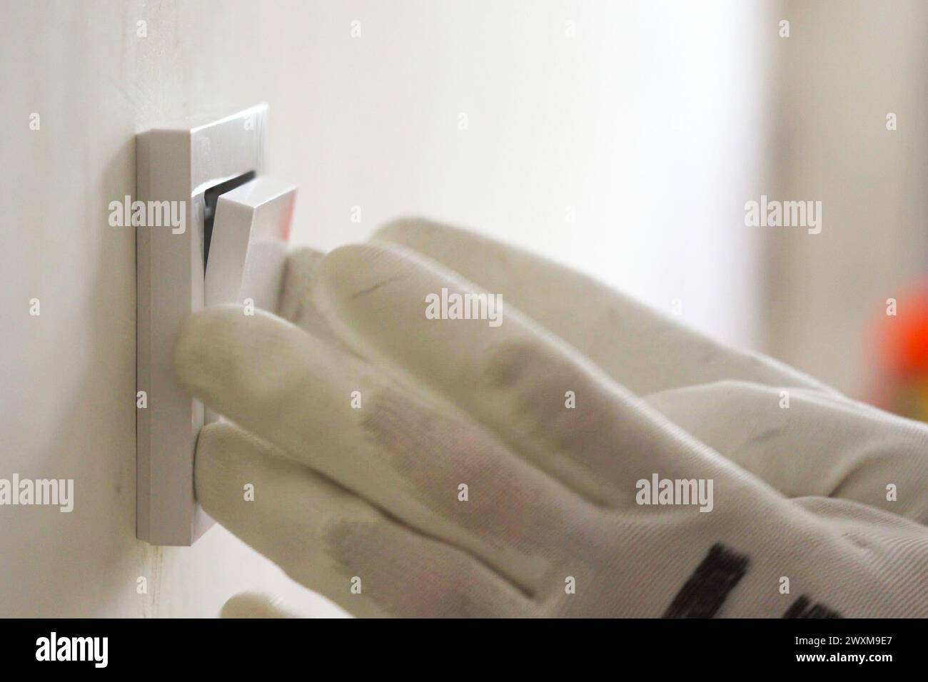 Installation of an electrical switch on the wall during the renovation ...