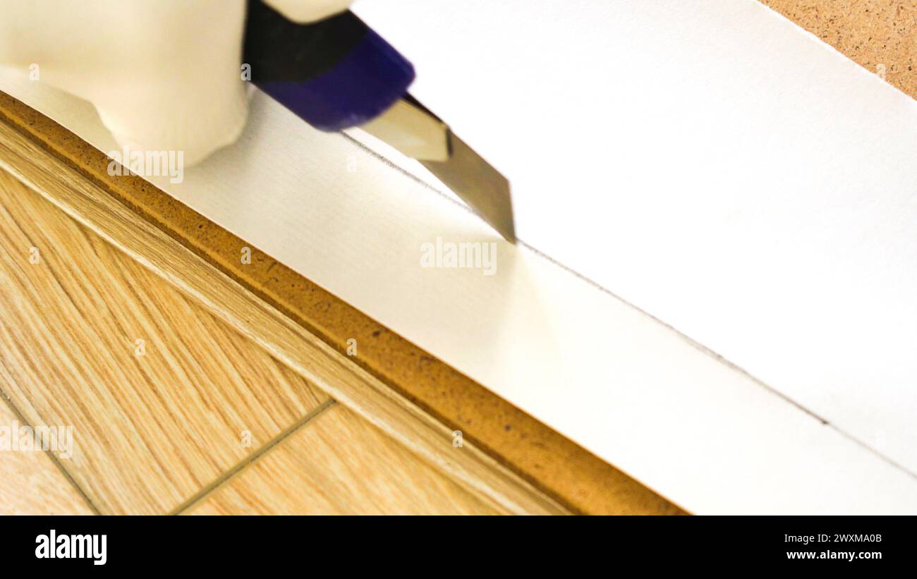 Cut paper with a knife Stock Photo - Alamy