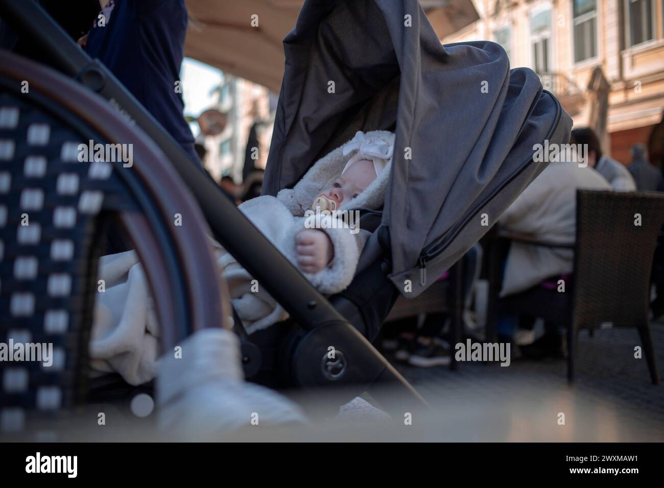 Belgrade, Serbia, Feb 17, 2024: Baby girl in a stroller at one of the ...