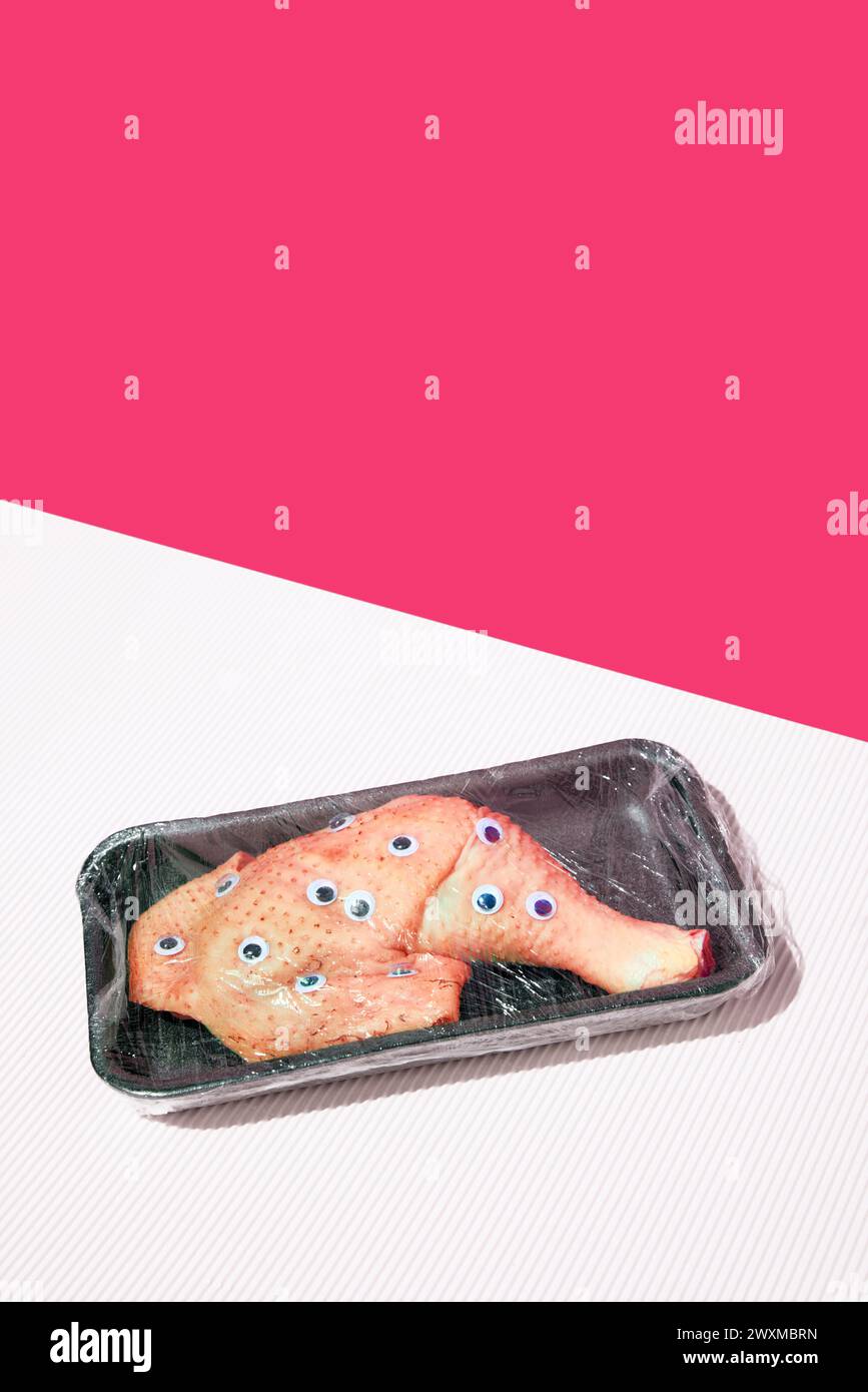 Chicken with googly eyes on it, wrapped in plastic packaging giant ...