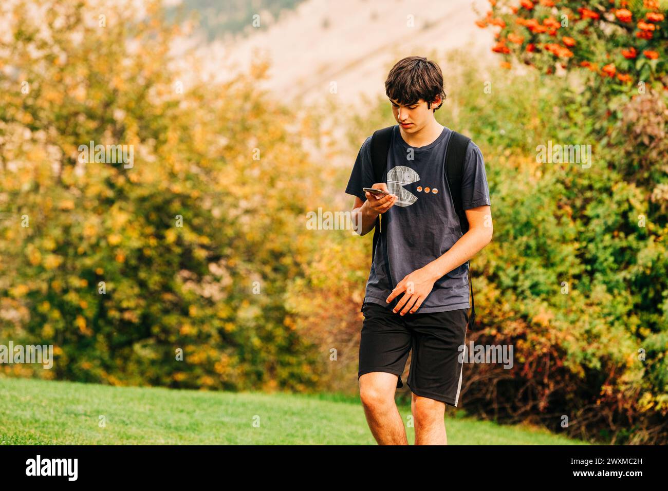 College boy in park hi-res stock photography and images - Alamy