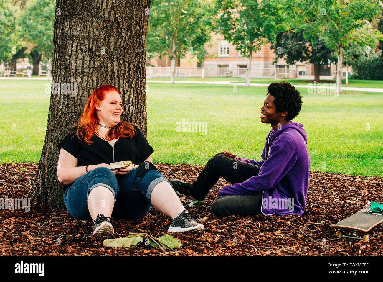 Multicultural students talking on campus at University of Montana Stock ...
