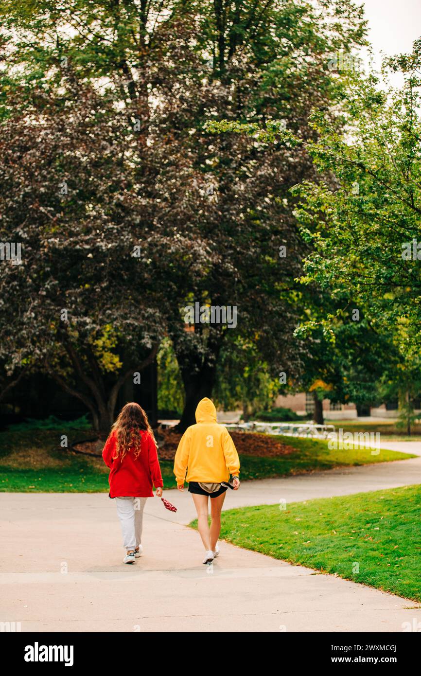 Backs of students talking hi-res stock photography and images - Alamy
