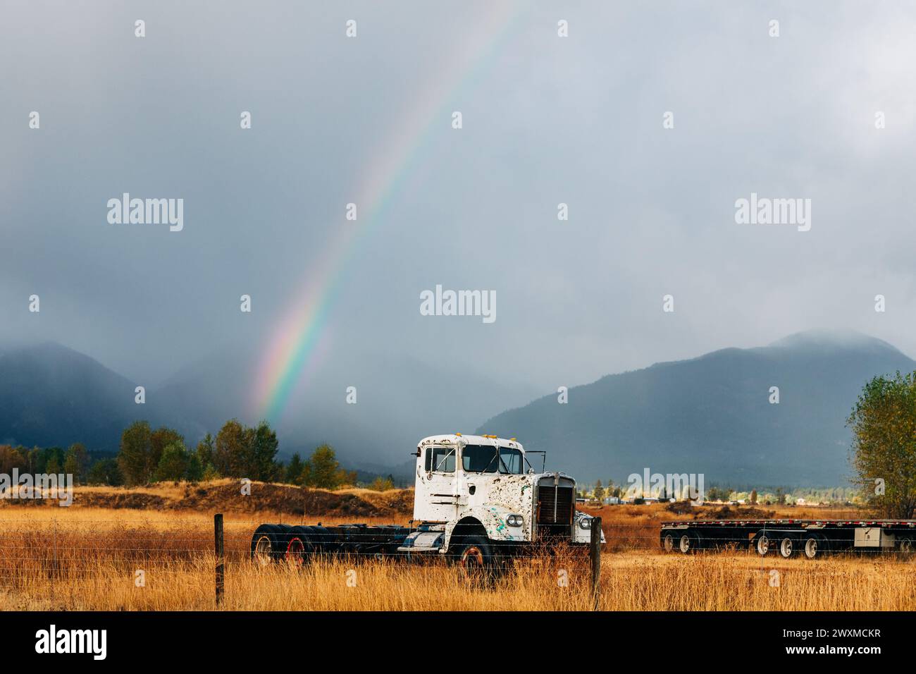 Rural Montana scene with rainbow over antique vintage truck Stock Photo ...