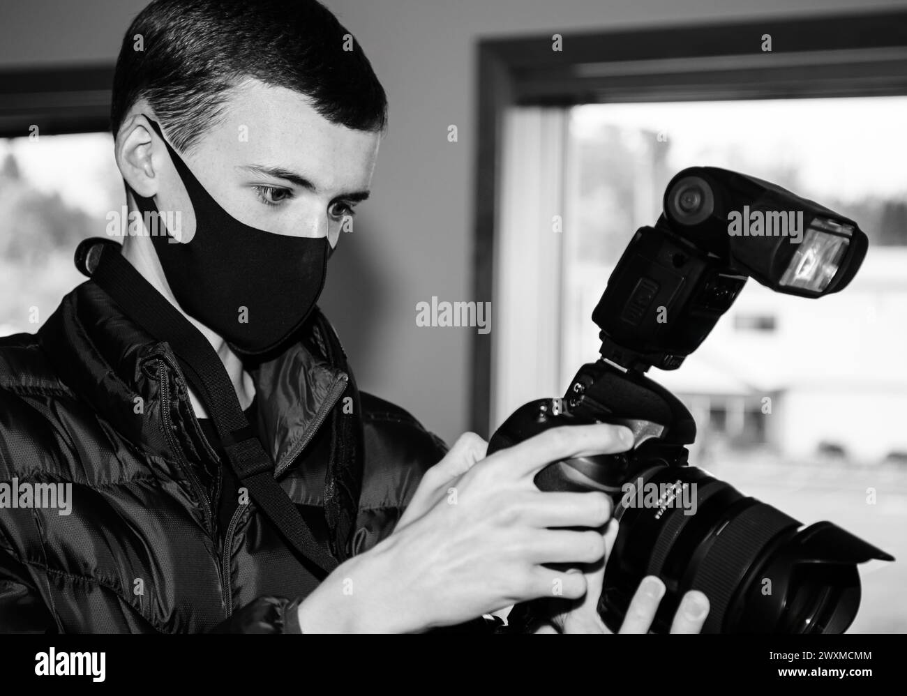 Male photography student learning flash Stock Photo - Alamy
