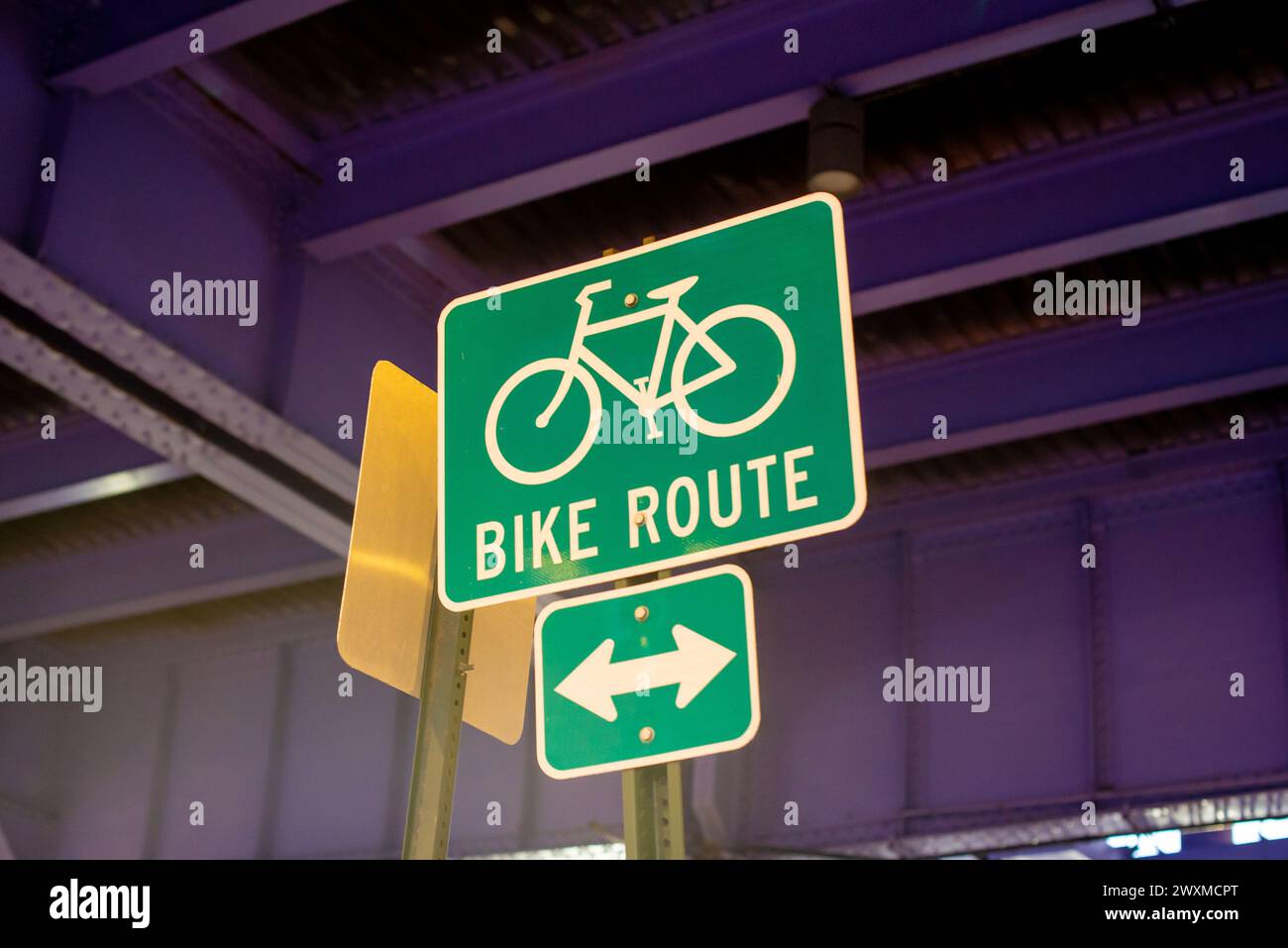 Bicycle route sign under bridge with changing lights Stock Photo - Alamy