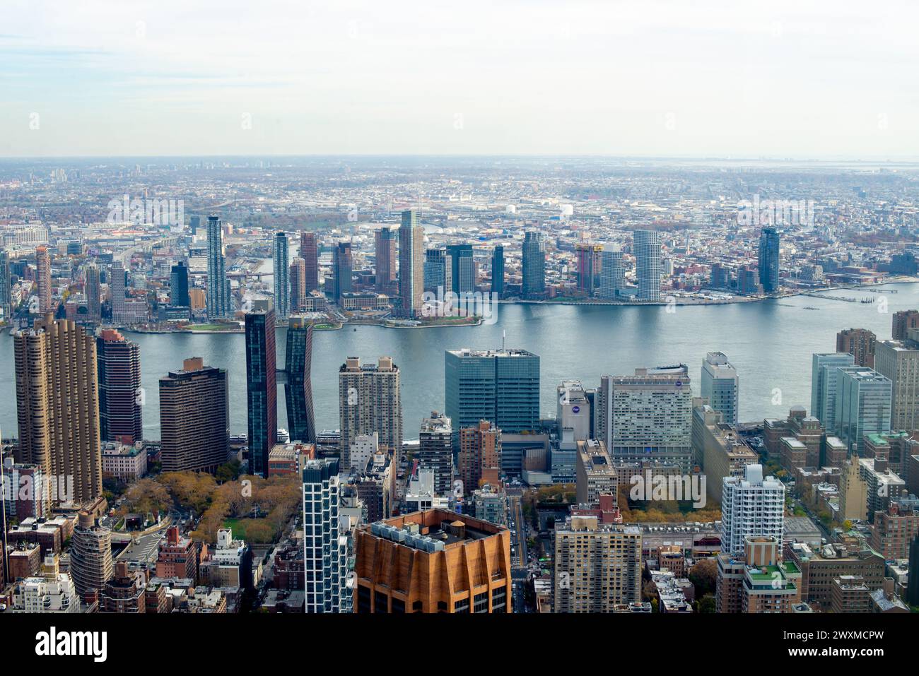 A sprawling city by a river in the distance Stock Photo - Alamy