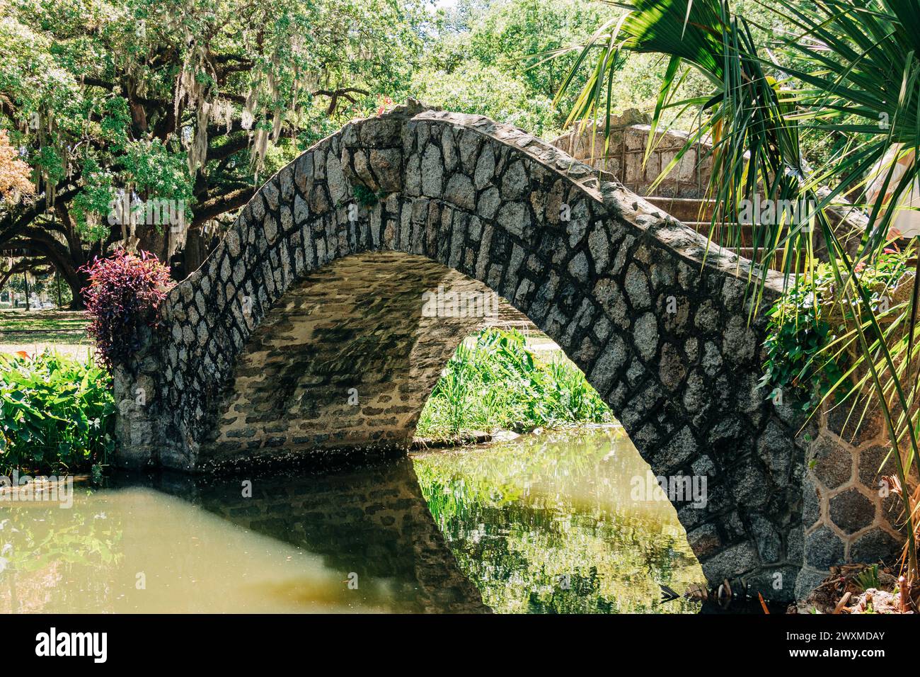 Historic arched stone bridge over waterway in City Park, New Orleans ...
