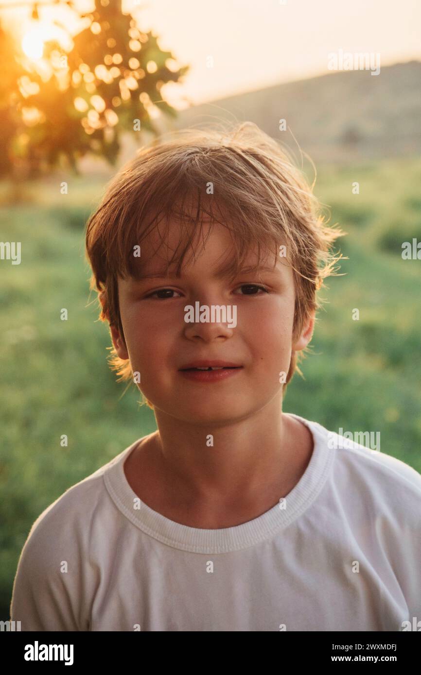 Boy lying on grass legs hi-res stock photography and images - Alamy