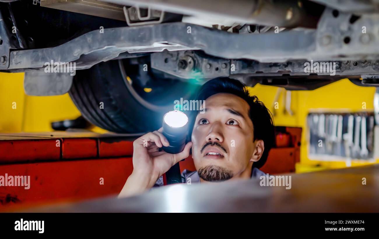 Worker under car change hi-res stock photography and images - Alamy