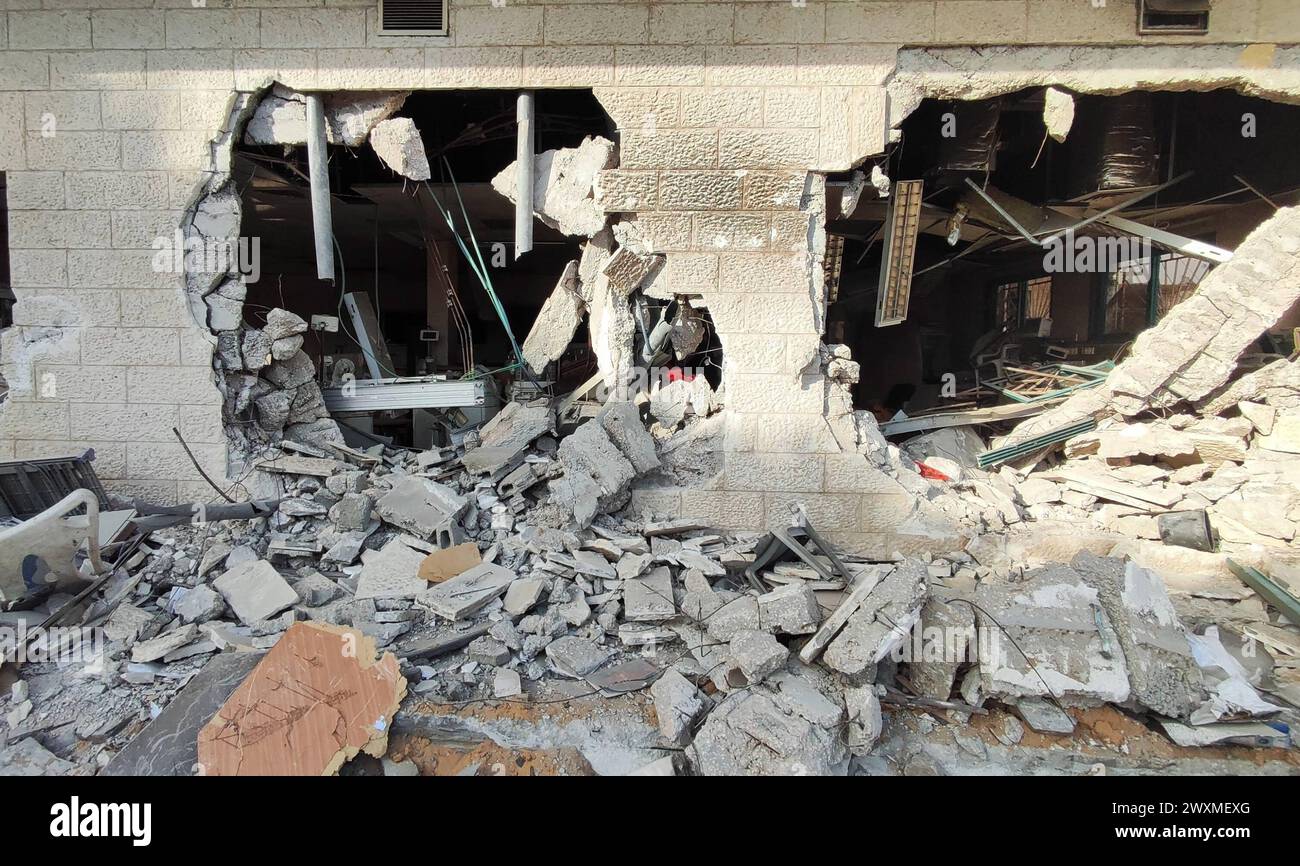 People are seen in the area where Al-Shifa Hospital and its surrounding ...
